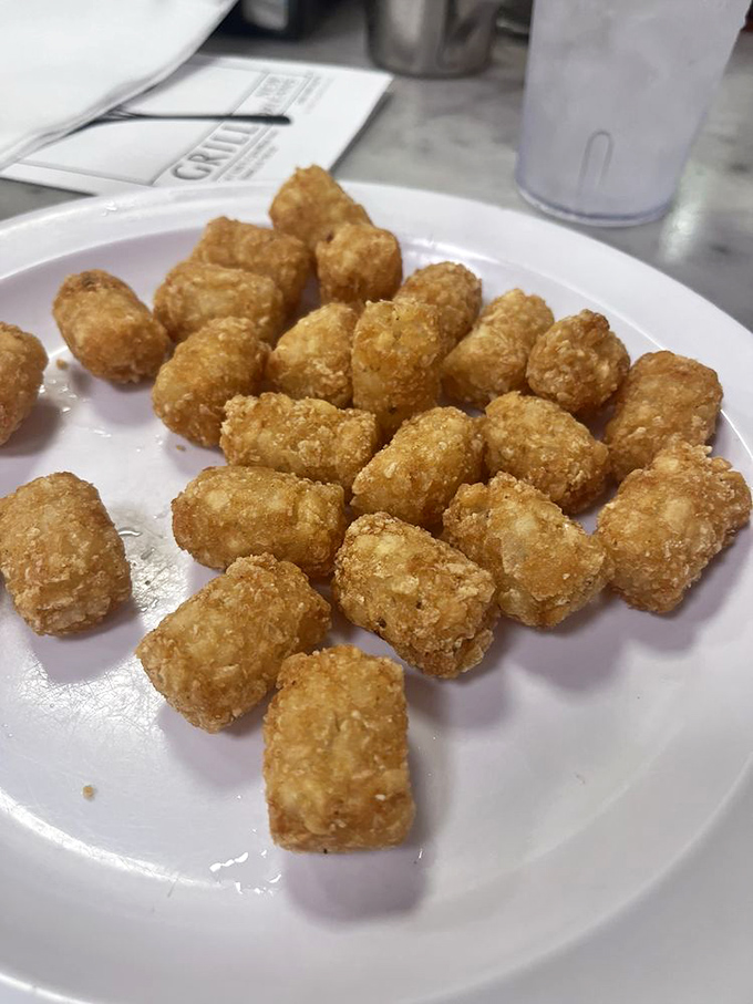 Tater tots that crunch like childhood memories&mdash;golden nuggets of potato perfection that make you wonder why you ever grew up.