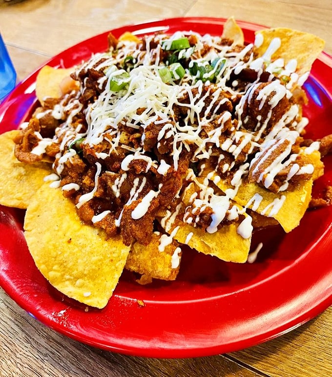 Nachos reimagined with artistic flair. Crispy tortilla chips provide the canvas for a masterpiece of meat, cheese, and sour cream.