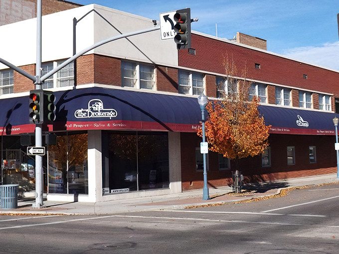 The Brokerage's classic storefront and autumn tree create that perfect fall-in-a-small-town postcard moment. Norman Rockwell would reach for his paintbrush.