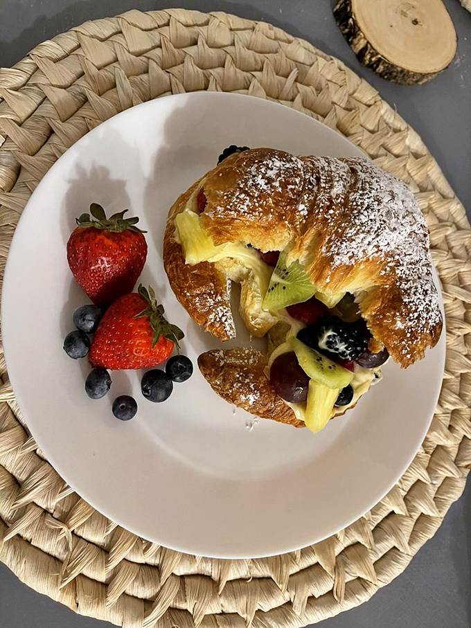 A croissant that's having an affair with fresh fruit. This breakfast romance is worth getting out of bed for, even on vacation.