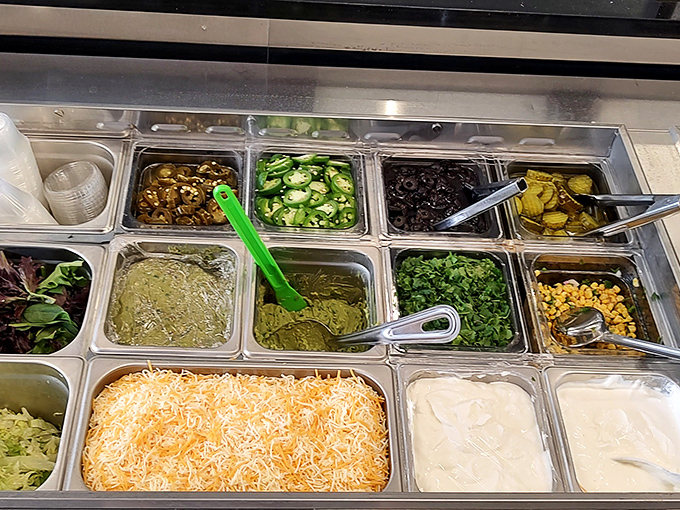 The build-your-own-masterpiece station. This colorful array of toppings and fillings is where burrito dreams are customized into reality.