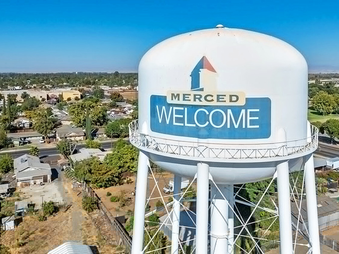 The iconic Merced water tower stands as both landmark and promise: "Welcome to a place where your retirement savings might actually last."