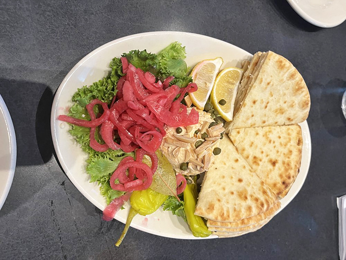 A deconstructed fish spread that invites participation&mdash;build each bite exactly how you want it, with pickled onions adding that perfect tangy counterpoint.