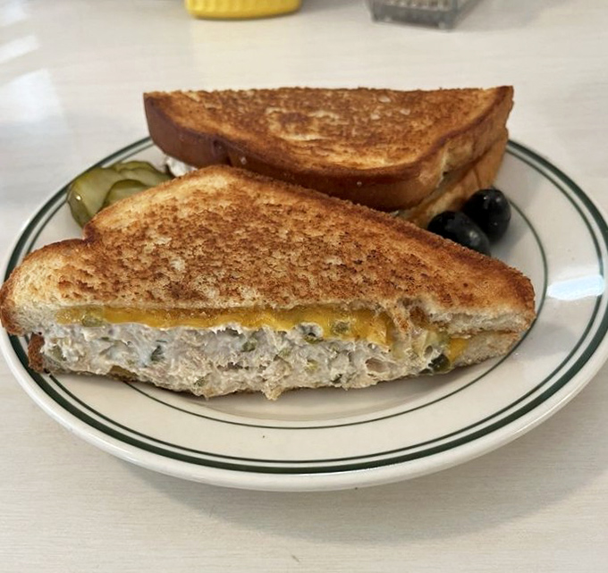 The tuna melt arrives perfectly grilled, cheese melted just right, making you wonder if there's a secret society of sandwich masters working behind that counter. If so, membership has its privileges.