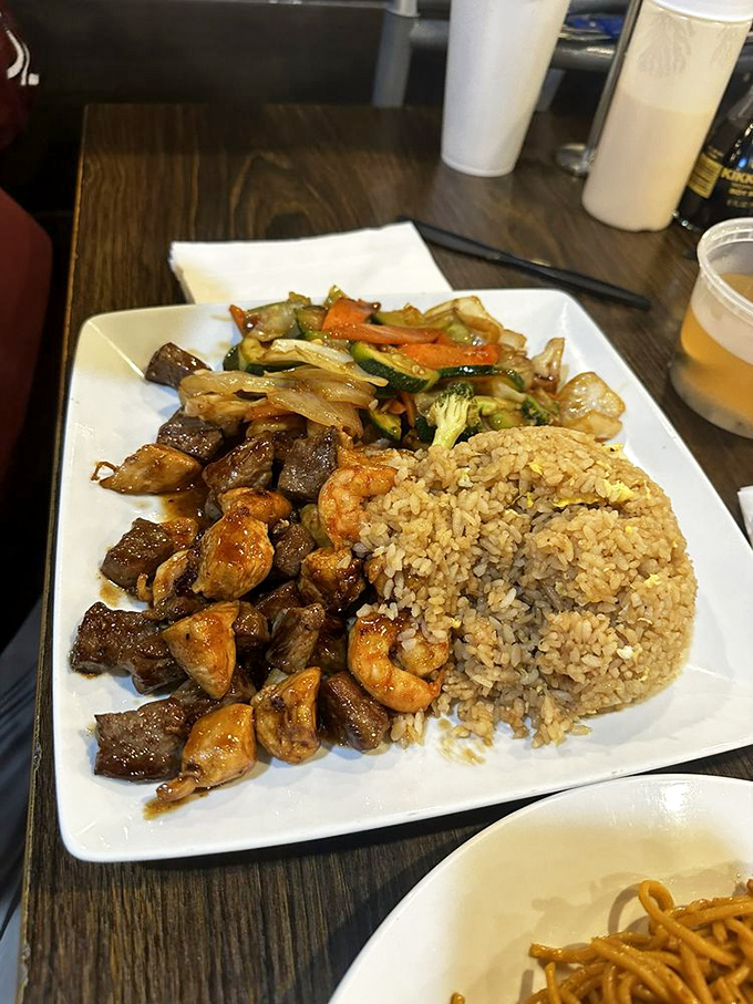 The surf and turf platter with fried rice&mdash;proof that sometimes you don't have to choose between land and sea when you can conquer both territories.