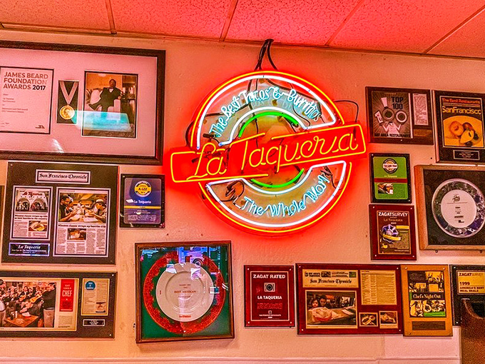 The wall of fame glows with well-earned pride. That neon sign has become as iconic to food lovers as Hollywood's sign is to movie fans.