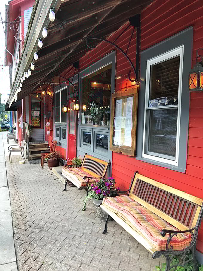 The West End Pub's cheerful red exterior and inviting benches practically whisper, "Come sit awhile and watch the world go by."