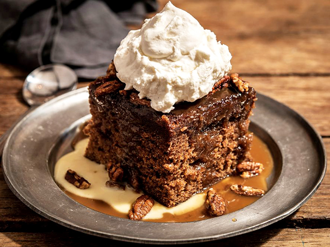 The legendary namesake dessert that launched it all. Bourbon-soaked toffee cake swimming in anglaise with fresh whipped cream&mdash;resistance is futile.