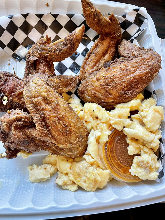 Fried chicken wings and scrambled eggs&mdash;proof that breakfast and dinner can coexist beautifully. This checkered paper plate holds the key to happiness.