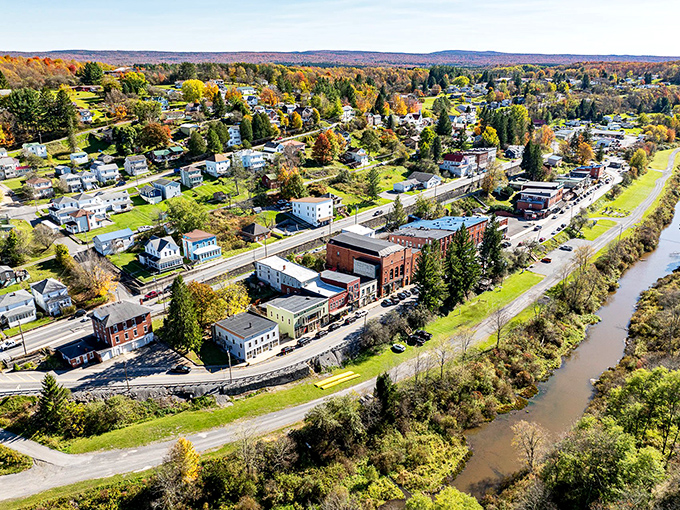 This aerial view reveals how Thomas nestles perfectly between rolling mountains and the winding river, a small town with an outsized personality.