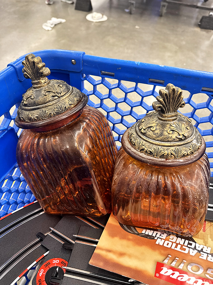 Amber glass containers with ornate lids&mdash;once holding someone's sugar and flour, now ready to become another kitchen's conversation piece.