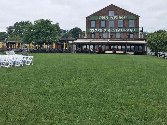 The restaurant's sprawling lawn offers a front-row seat to nature's show, with the historic building standing guard.