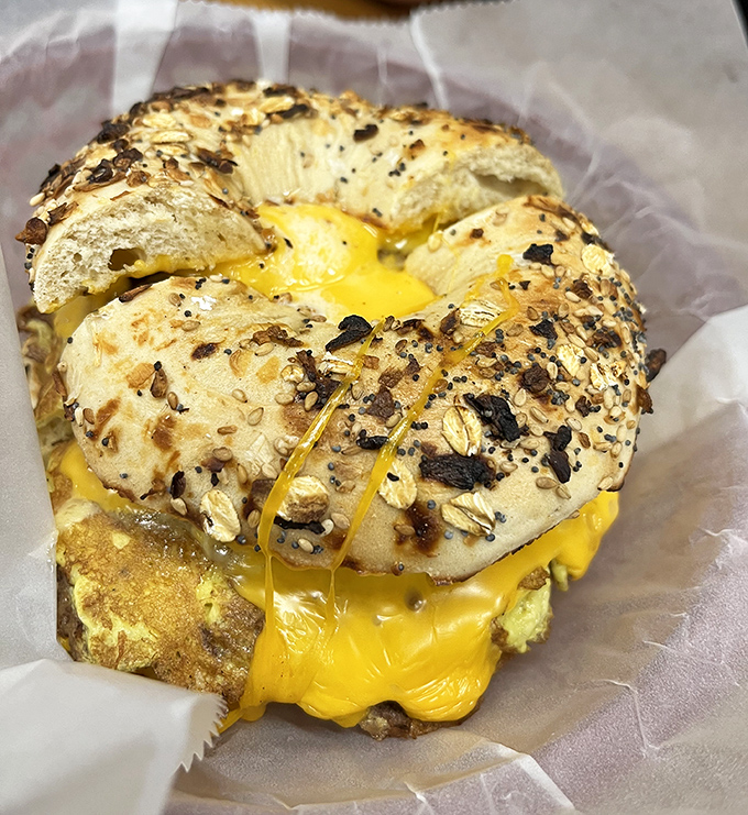 This isn't just breakfast&mdash;it's performance art. The everything bagel wearing a melted cheese halo deserves its own standing ovation.