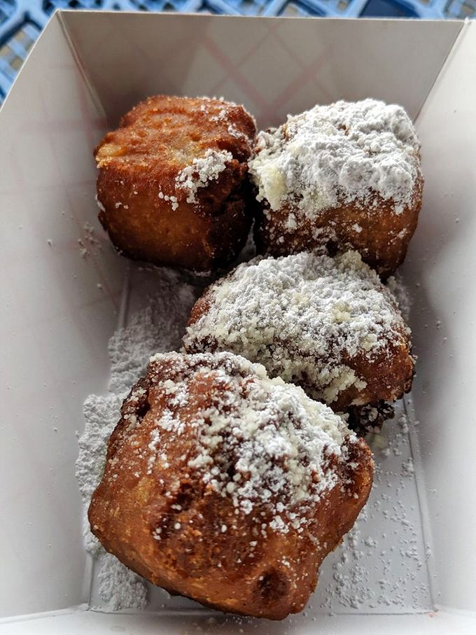 Powdered sugar-dusted banana bites – proof that sometimes the simplest desserts create the most powerful nostalgia. One bite and you're eight years old again.