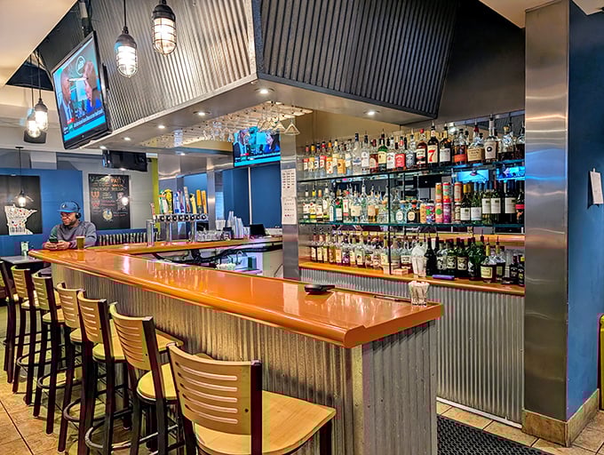 The bar at The Patty Wagon isn't just well-stocked—it's a liquid library of possibilities to wash down those legendary fries.