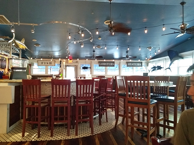 The gleaming bar beckons with the promise of cold drinks and seafood tall tales—the perfect combo after a day at the beach.