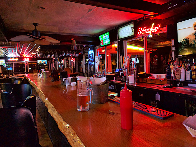 The bar's warm glow promises cold drinks and good stories. That Yuengling sign isn't just decoration&mdash;it's a beacon for thirsty travelers.