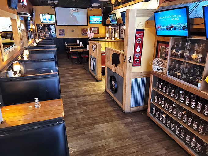 Booths designed for serious eating sessions. The wood-paneled dividers create intimate spaces for the important business of barbecue appreciation.