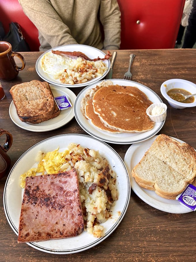 The breakfast spread that answers the eternal question: "Why choose one thing when you can have it all?" Pancakes, eggs, ham, and toast&mdash;the Mount Rushmore of morning meals.