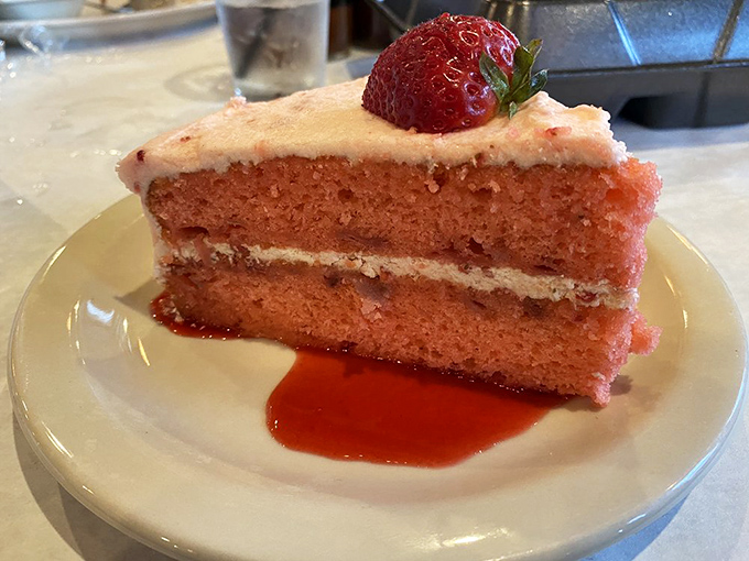 The strawberry cake proves that dessert isn't an afterthought—it's the encore performance after the meat symphony has reached its crescendo.