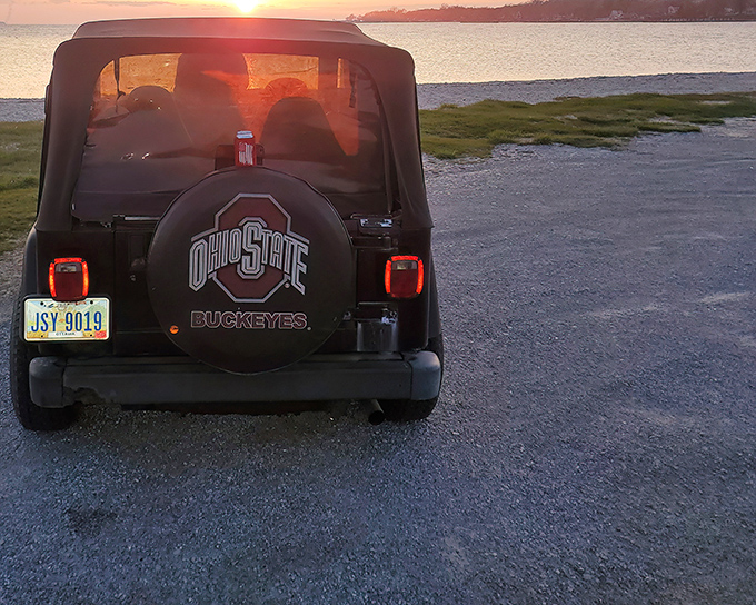 Buckeye pride meets island sunset. Even the most dedicated OSU fan must occasionally pause the tailgating to appreciate nature's evening show.