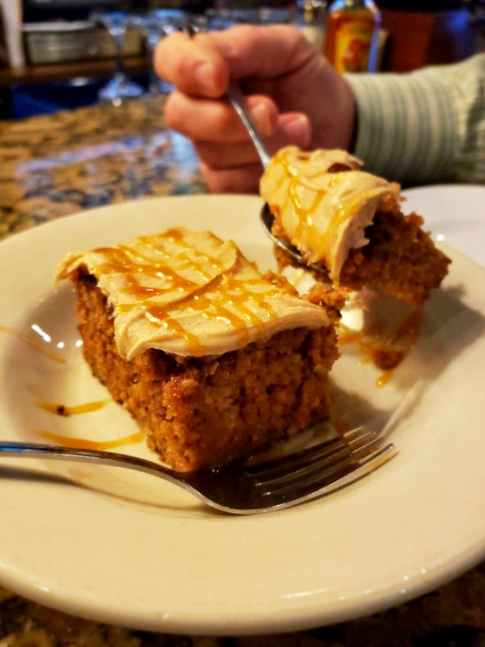 Carrot cake that manages to convince you it's practically a vegetable. That cream cheese frosting with caramel drizzle is just there for moral support.