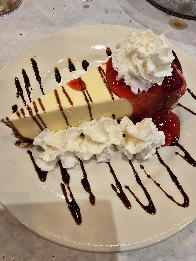 Cheesecake: the sweet finale that somehow finds room in stomachs already filled with seafood&mdash;proof that dessert occupies its own special compartment.