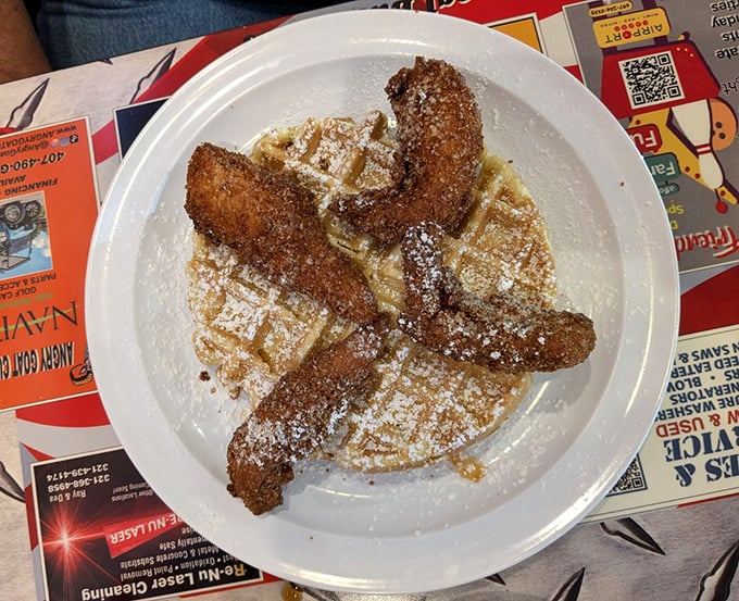 Chicken and waffles&mdash;where breakfast and dinner hold hands and jump into deliciousness together. The powdered sugar dusting is just showing off.