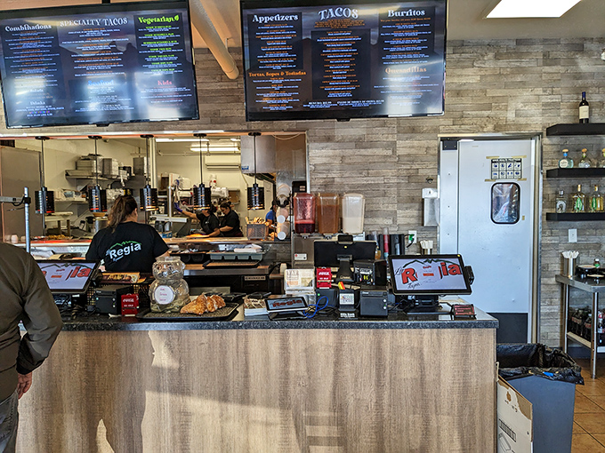 Where the magic happens: La Regia's bustling counter and kitchen. Like watching a well-choreographed dance, the staff transforms simple ingredients into extraordinary meals.