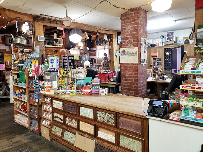 Where commerce meets history at a wooden counter worn smooth by generations of elbows and friendly conversations. This isn't just a checkout&mdash;it's a community crossroads.