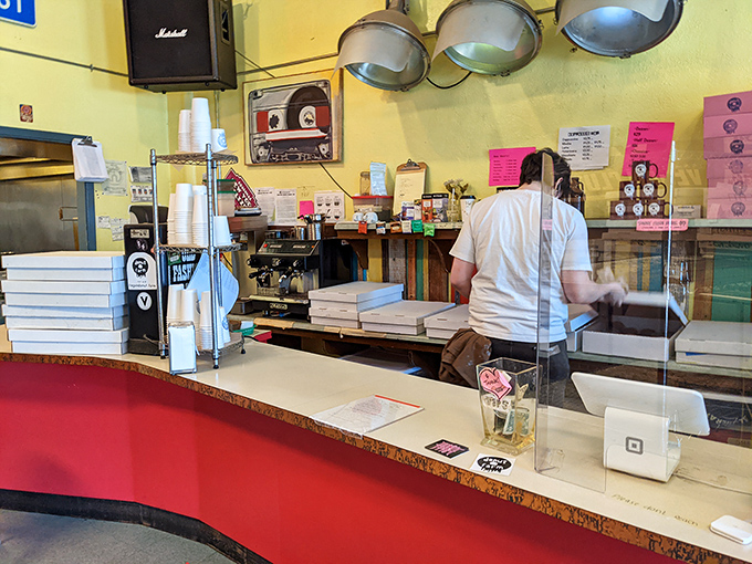 Behind this counter, vegan wizardry happens daily &ndash; the pink menu board serving as a spell book for plant-based enchantment.