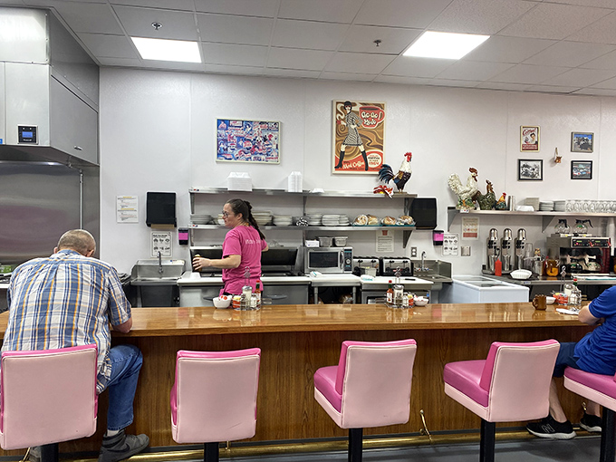The counter&mdash;where solo diners become family and the coffee keeps flowing. Some of life's best conversations happen on pink swivel chairs.