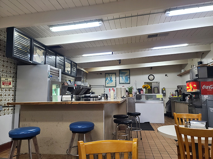 The counter where dreams come true. Simple stools invite you to perch and watch the choreographed dance of short-order cooking at its finest.