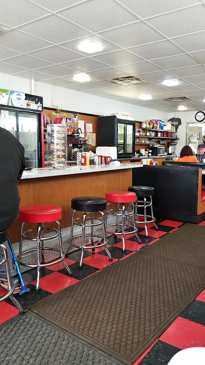 Counter seating where regulars have worn grooves into those classic red and black stools &ndash; the best spot for solo diners and coffee refill efficiency.