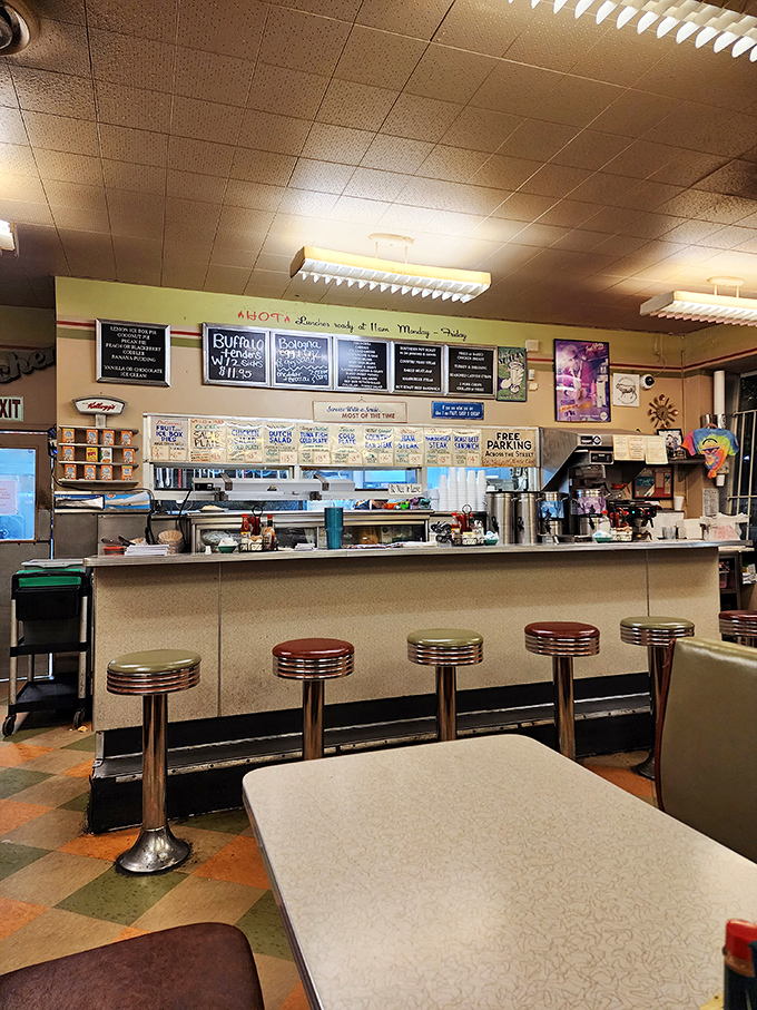 The counter seating&mdash;where solo diners become regulars and the short-order ballet unfolds before your eyes. Prime real estate for breakfast enthusiasts.