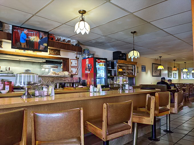 The counter seating&mdash;where solo diners become temporary family, watching short-order magic happen while coffee mugs never reach empty.