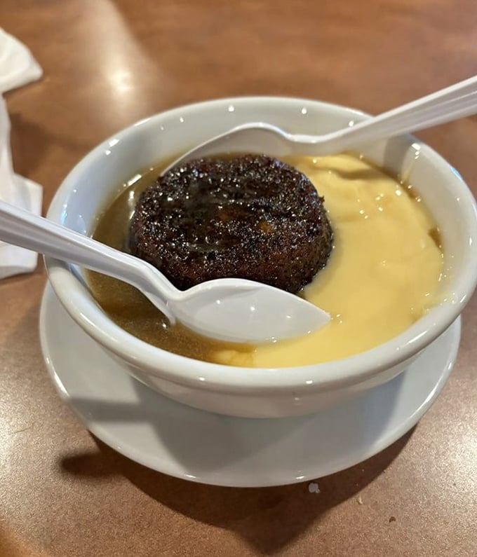 Sticky toffee pudding swimming in custard &ndash; proof that the British may have been playing the dessert game better than we realized all along.