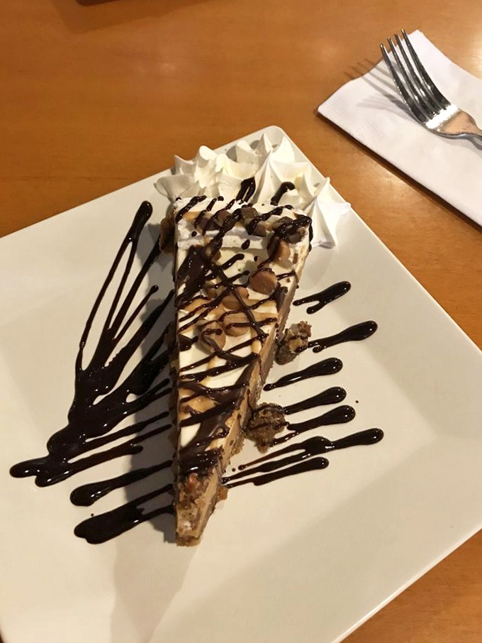 Not all heroes wear capes, but this cheesecake definitely deserves a medal. The chocolate drizzle is just showing off at this point.