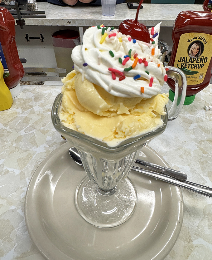 The crown jewel of desserts! This ice cream sundae&mdash;topped with whipped cream, sprinkles, and a cherry&mdash;is the exclamation point at the end of a perfect meal.