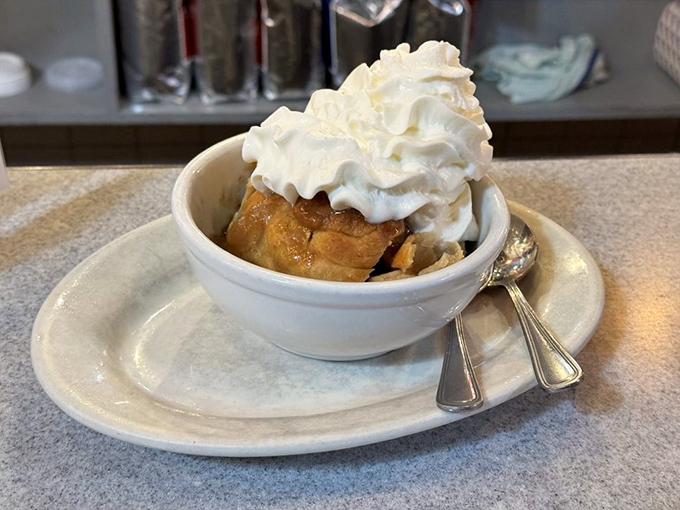 The apple dumpling in its final, most glorious form&mdash;crowned with whipped cream and ready to make memories that outlast the meal itself.