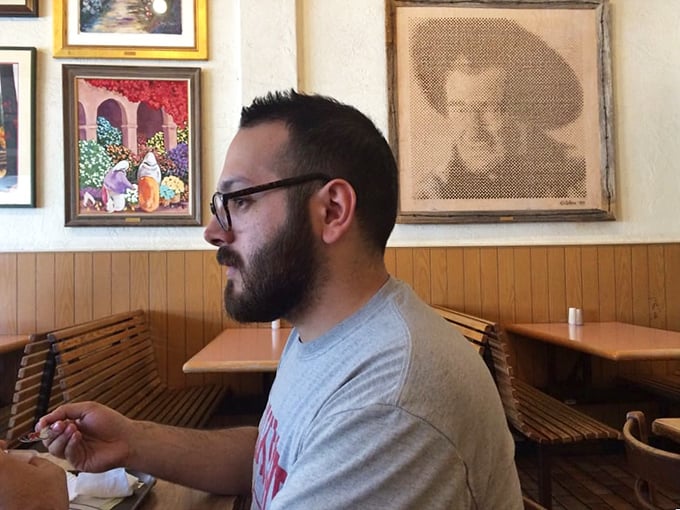 Where John Wayne watches over your meal from framed portraits, and the wooden booths have heard more Albuquerque stories than a bartender.