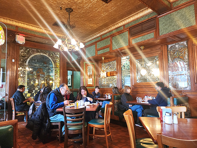 The warm, wood-paneled dining room buzzes with conversation and anticipation &ndash; a temple of breakfast where pancake dreams come true daily.