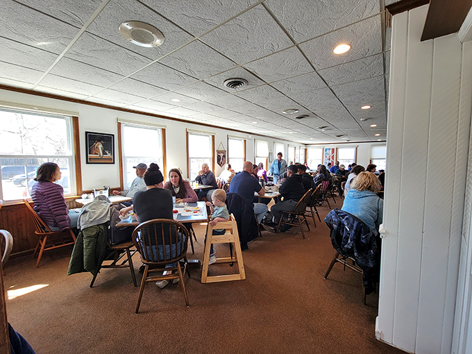 A dining room filled with happy eaters proves the universal truth: good food brings people together, especially when meatloaf is involved.