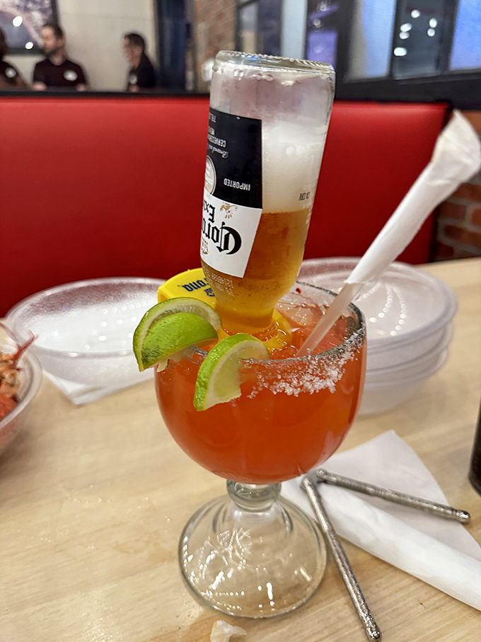 A "Coronarita"&mdash;the architectural marvel of drinks, with a Corona tipped into a margarita, proving excess isn't limited to the food offerings.