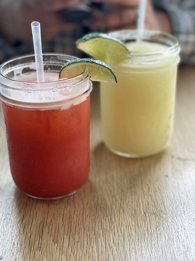 These aren't just beverages&mdash;they're liquid refreshment strategically designed to cut through cheese richness. Those lime wedges aren't garnish&mdash;they're necessity.