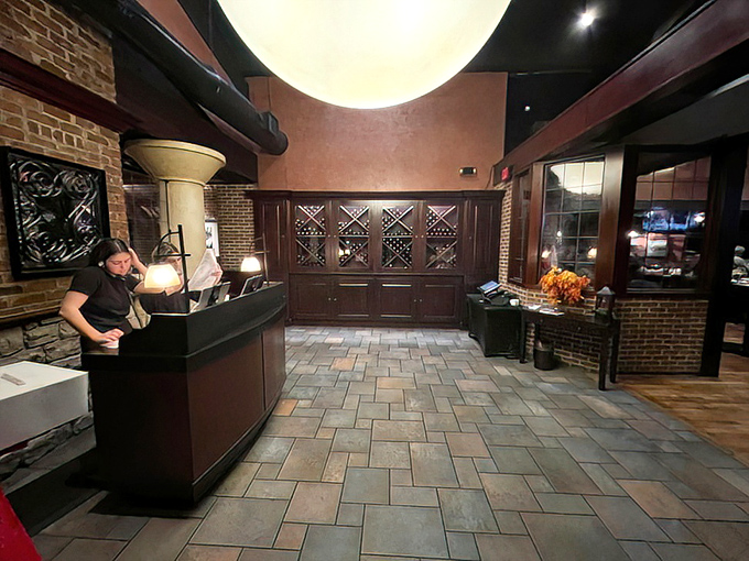 The welcoming entrance sets expectations high with stone and brick details that whisper promises of exceptional dining experiences ahead.