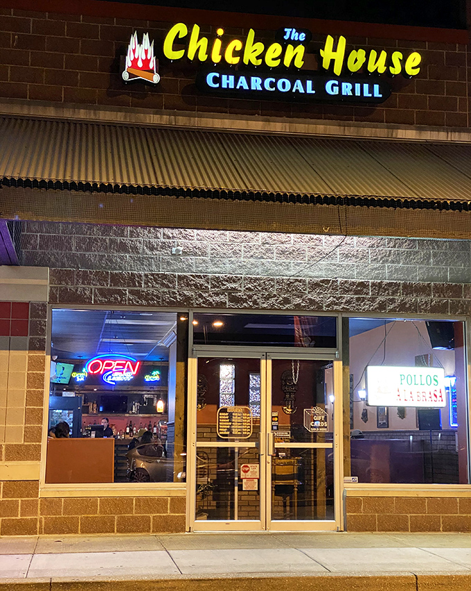 The illuminated nighttime entrance beckons hungry travelers. That neon "OPEN" sign might be the most beautiful sight when you're craving Peruvian flavors.