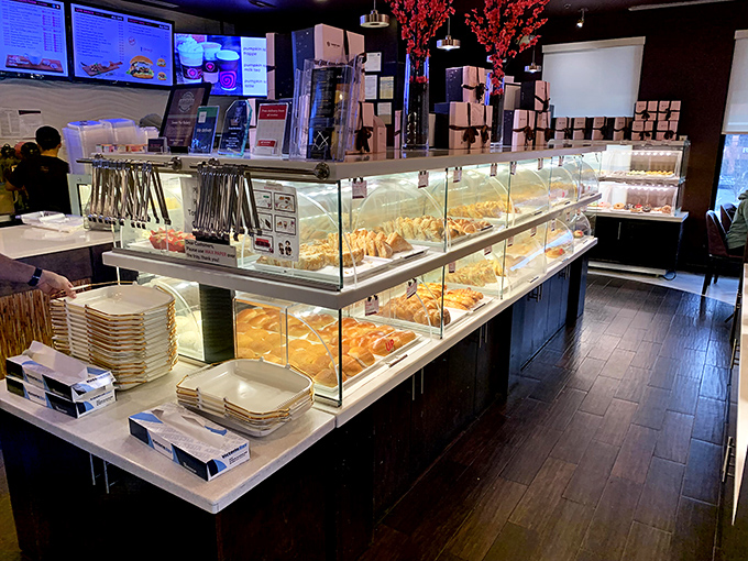 The display case at Sweet Hut isn't just showing pastries; it's exhibiting edible art that makes museum-going seem like a waste of calories.