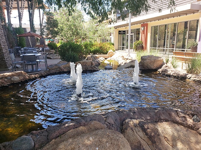A tranquil fountain oasis where shoppers pause to contemplate life's greatest questions, like "Do I really need another pair of sunglasses?"