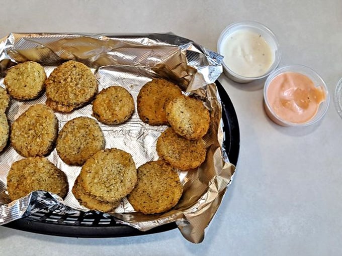 Fried pickles&mdash;the unsung heroes of appetizers. These golden discs of tangy goodness with dipping sauces are worth every mile of the drive. 
